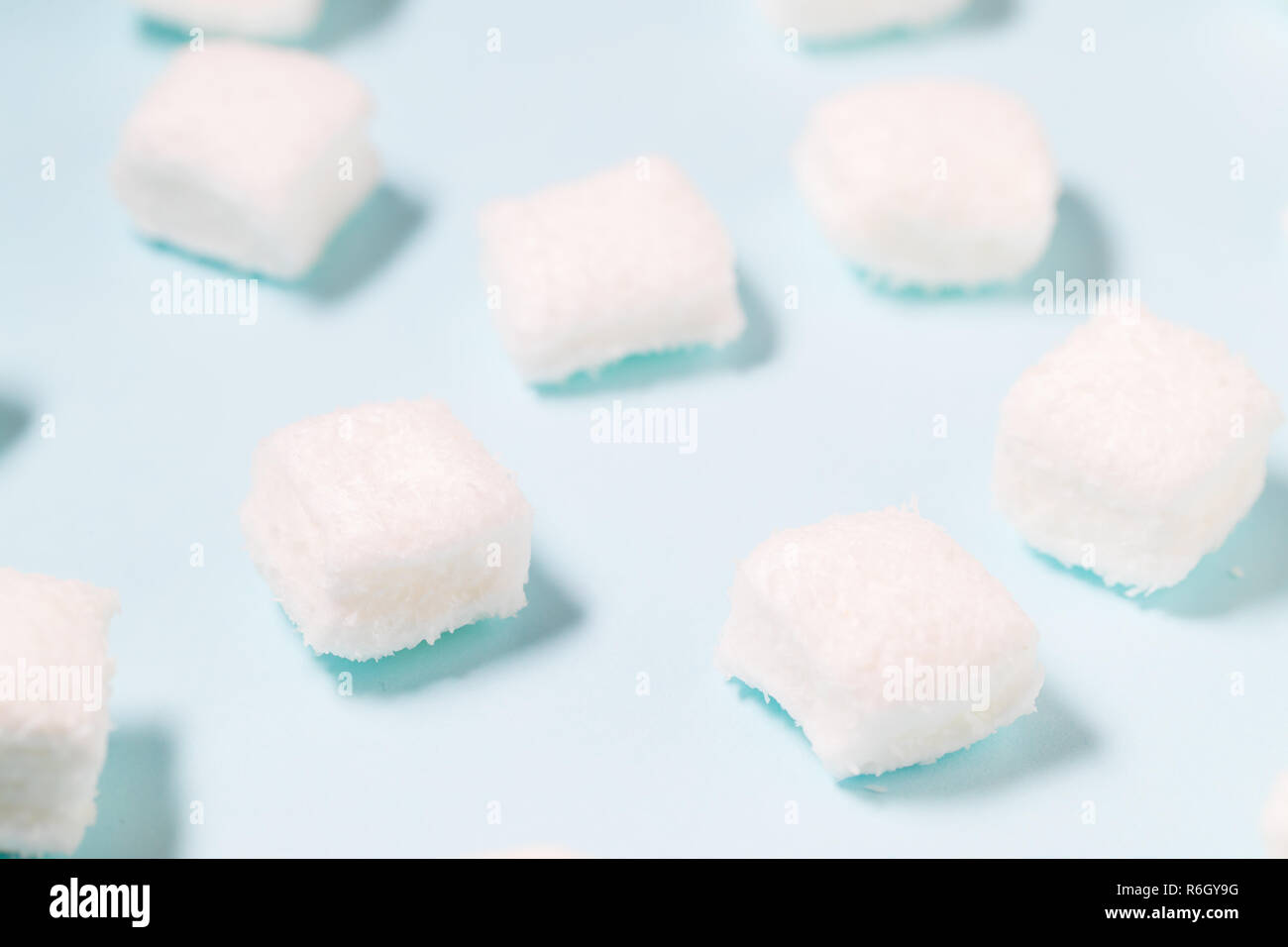 Marshmallow candy on blue Stock Photo - Alamy