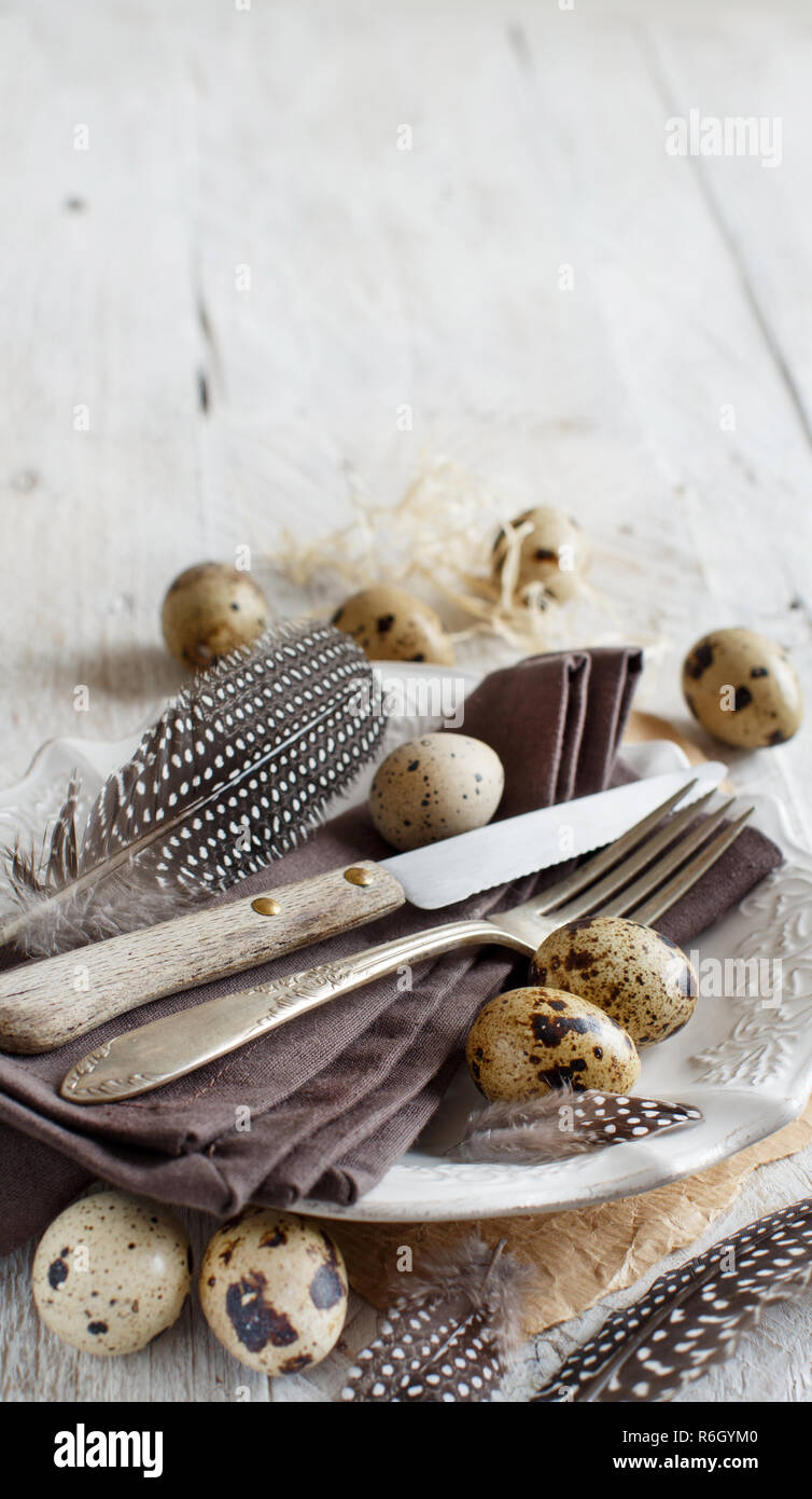 Easter table setting with quail eggs Stock Photo - Alamy