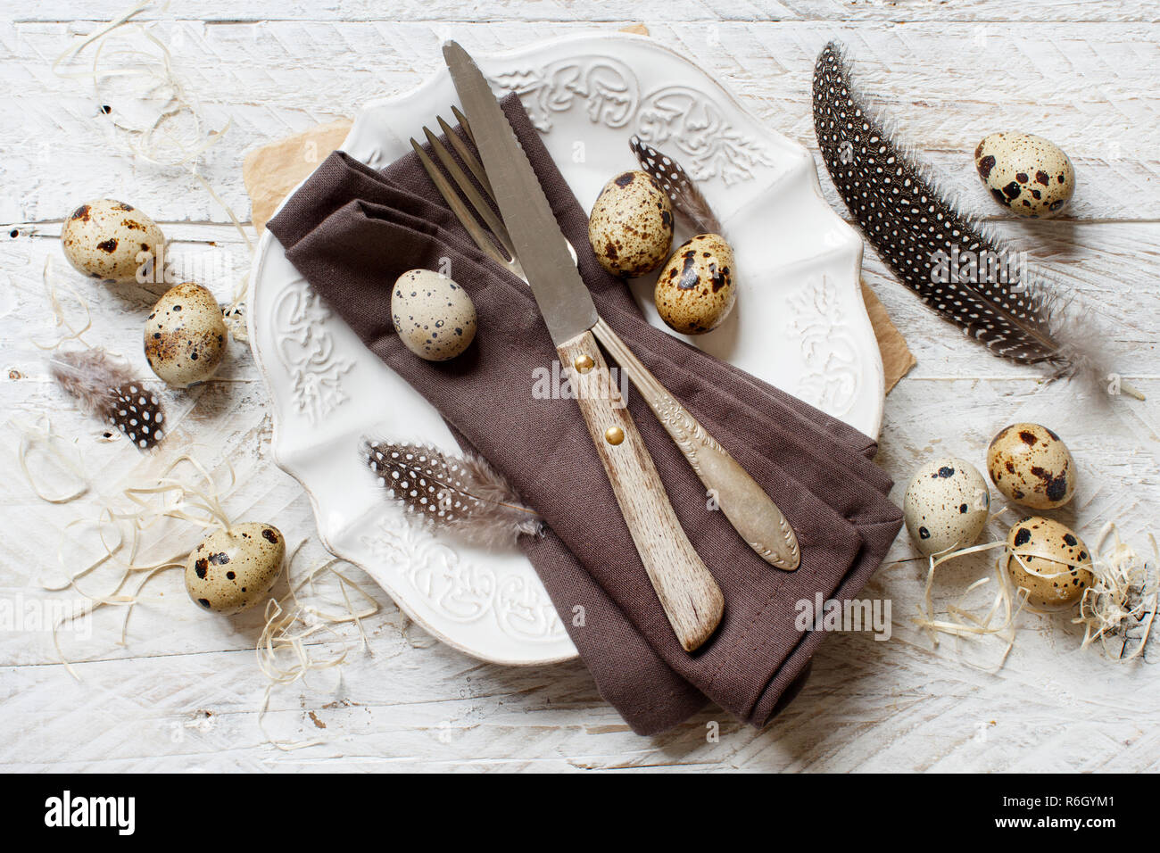 Easter table setting with quail eggs Stock Photo - Alamy