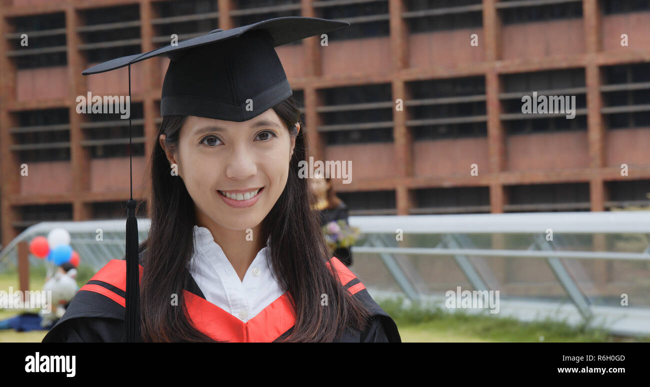 Asian Woman with graduation gown Stock Photo - Alamy