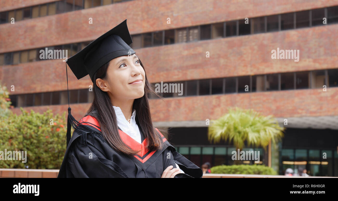 Graduation woman thinking of future Stock Photo - Alamy