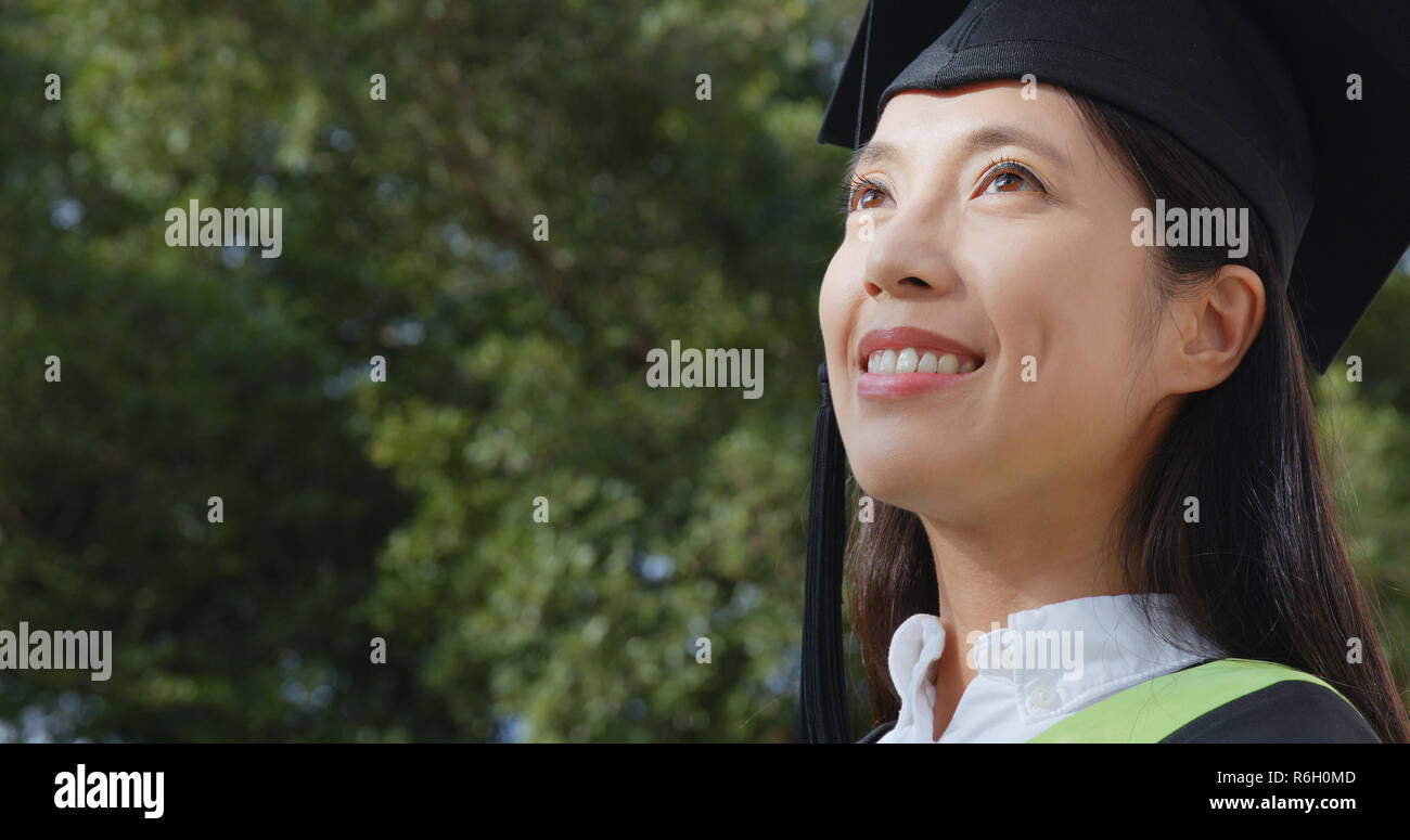 Woman get graduation think of future Stock Photo - Alamy