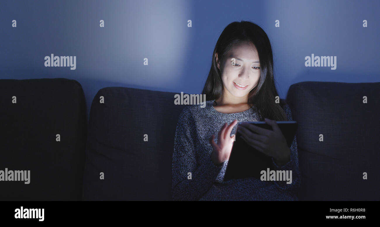 Asian woman use digital tablet at night Stock Photo - Alamy