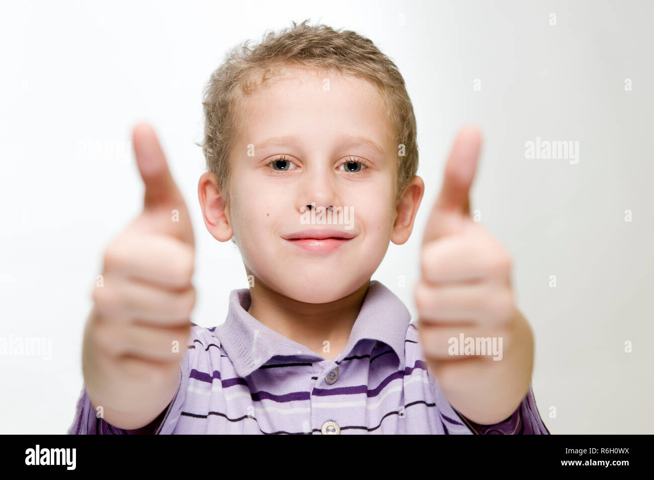 boy show two thumbs up wide Stock Photo - Alamy