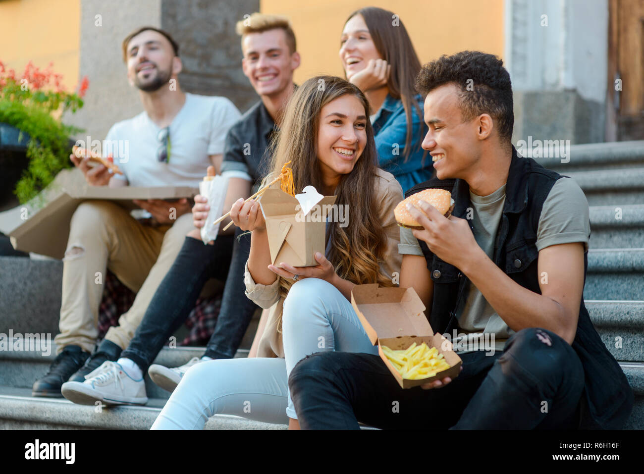 Friends are resting and eating Stock Photo - Alamy