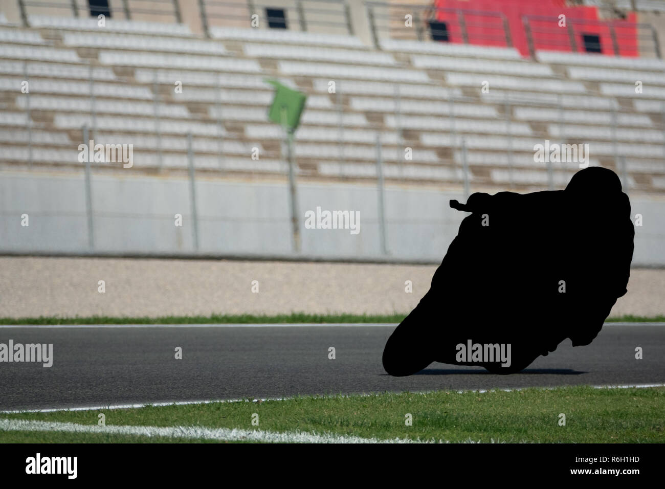 Motorbike outline of racing pilot tracing curve in circuit Stock Photo ...