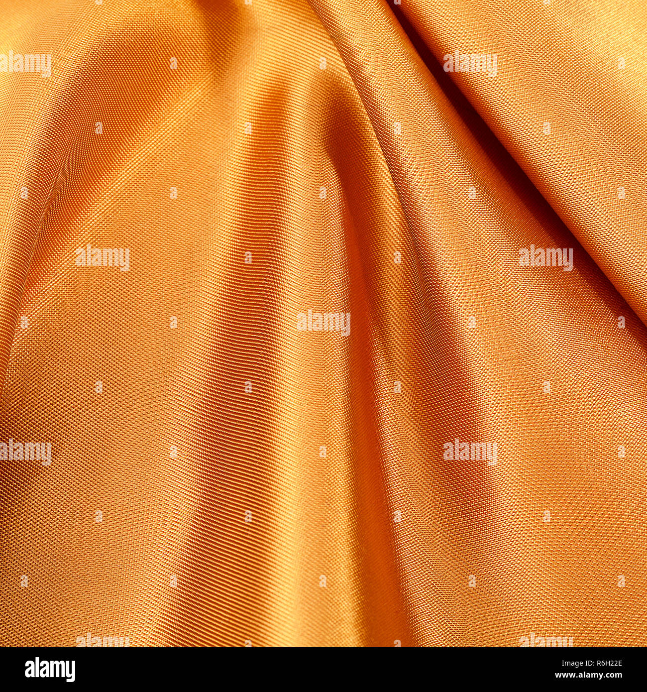 Silk background, texture of yellow shiny fabric Stock Photo - Alamy