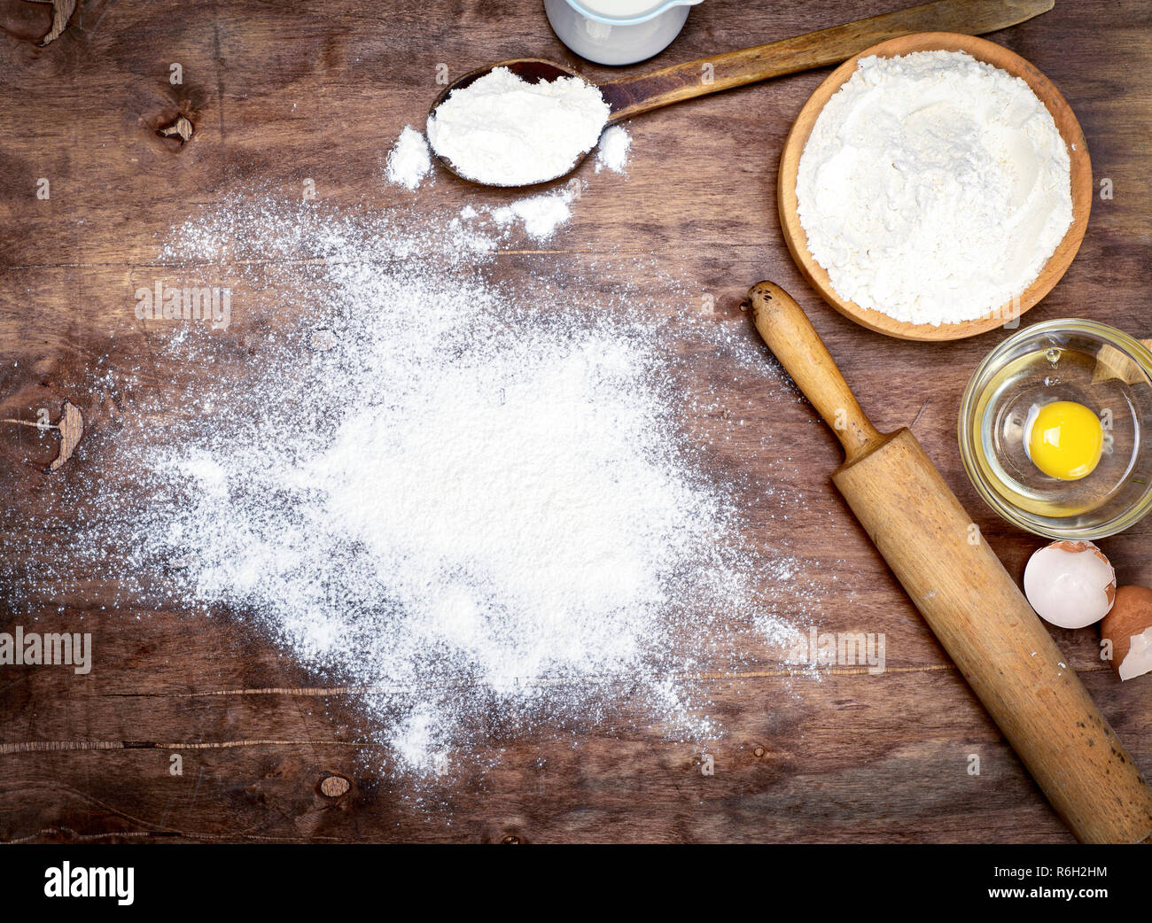 powdered flour on a brown wooden background Stock Photo - Alamy