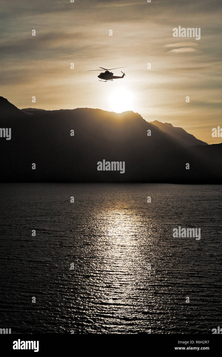 Reflection flying helicopter in water hi-res stock photography and ...