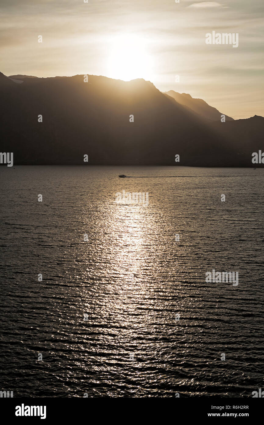 Small boat sailing in the sea Stock Photo - Alamy