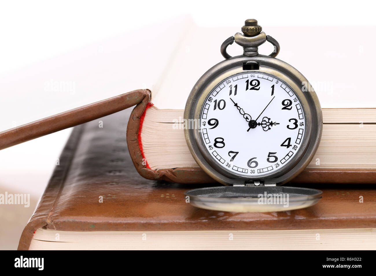 Pocket watch book stack hi-res stock photography and images - Alamy