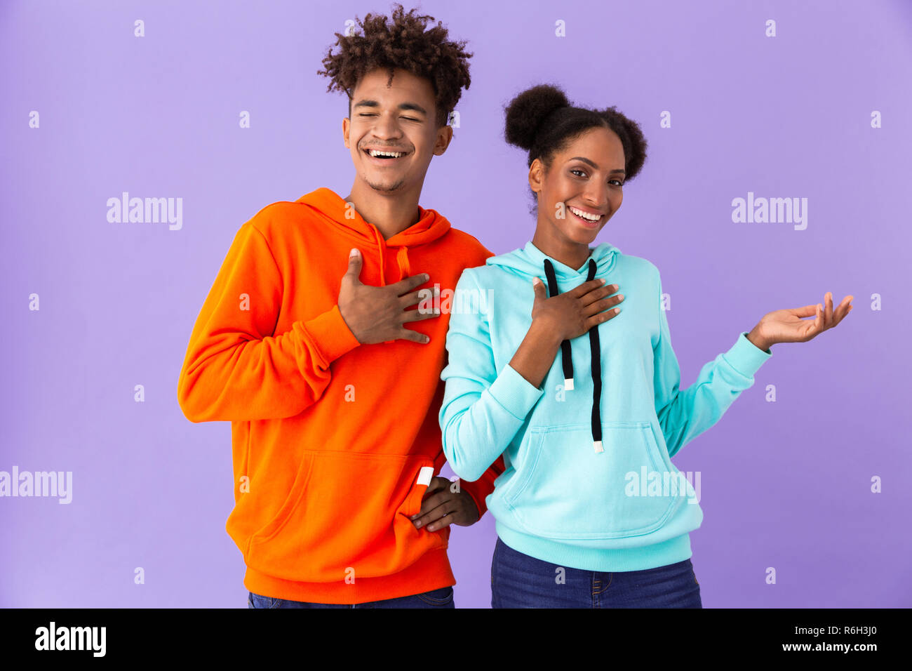 Photo of young african american man and woman standing together and ...