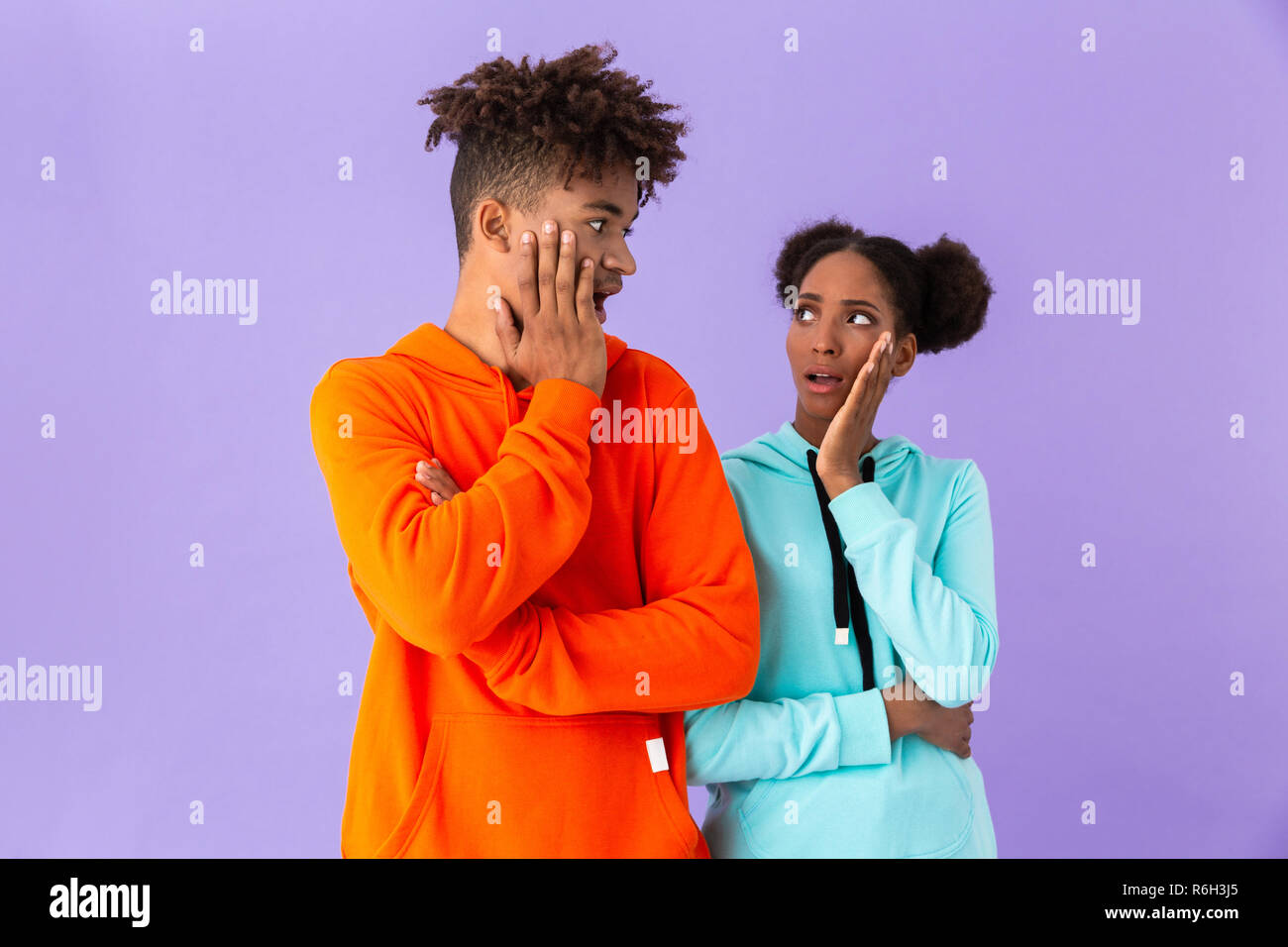 Photo of surprised african american brother and sister screaming and ...