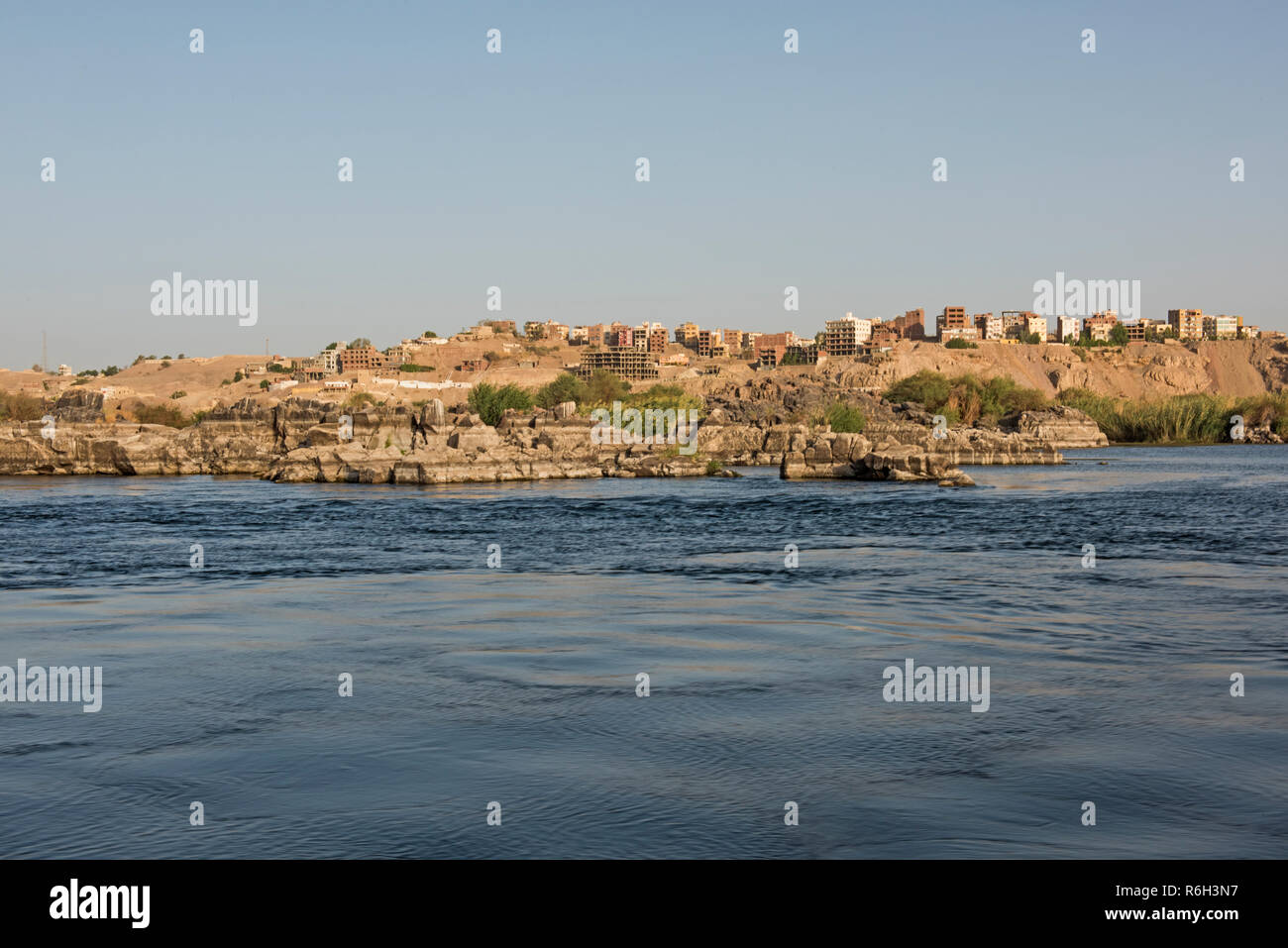 View down large wide river Nile in Aswan Egypt through rural ...