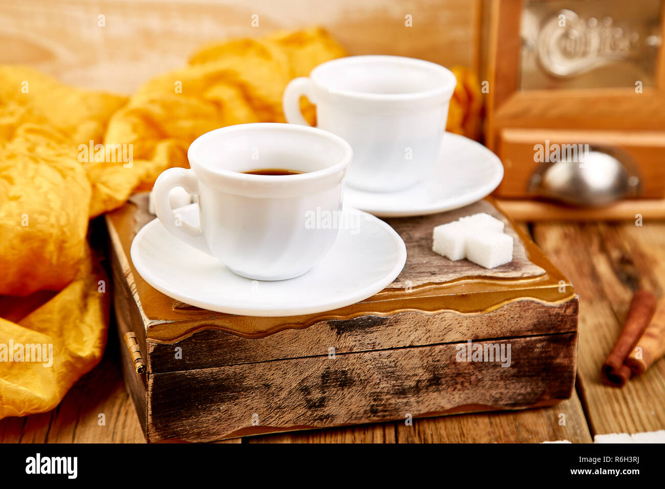 Two cups of coffee espresso near sugar cube on rustic wooden table ...