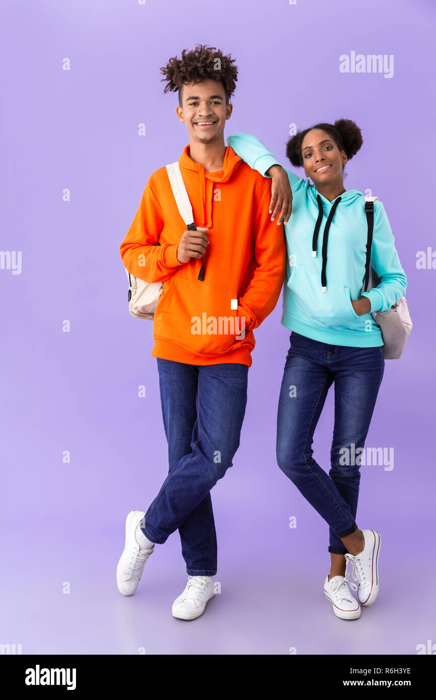 Full length photo of african american students wearing backpacks ...