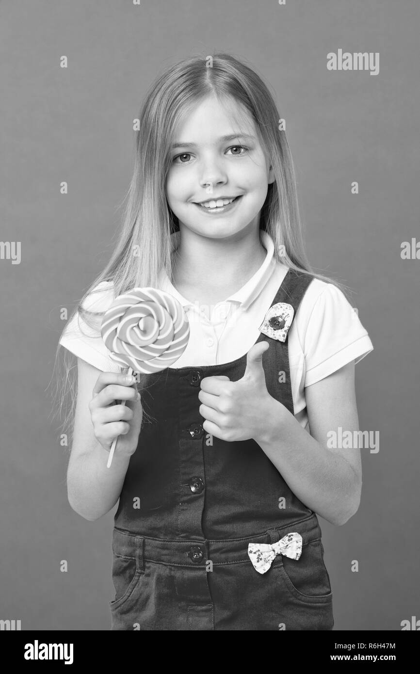 Girl eating sweets Black and White Stock Photos & Images - Alamy