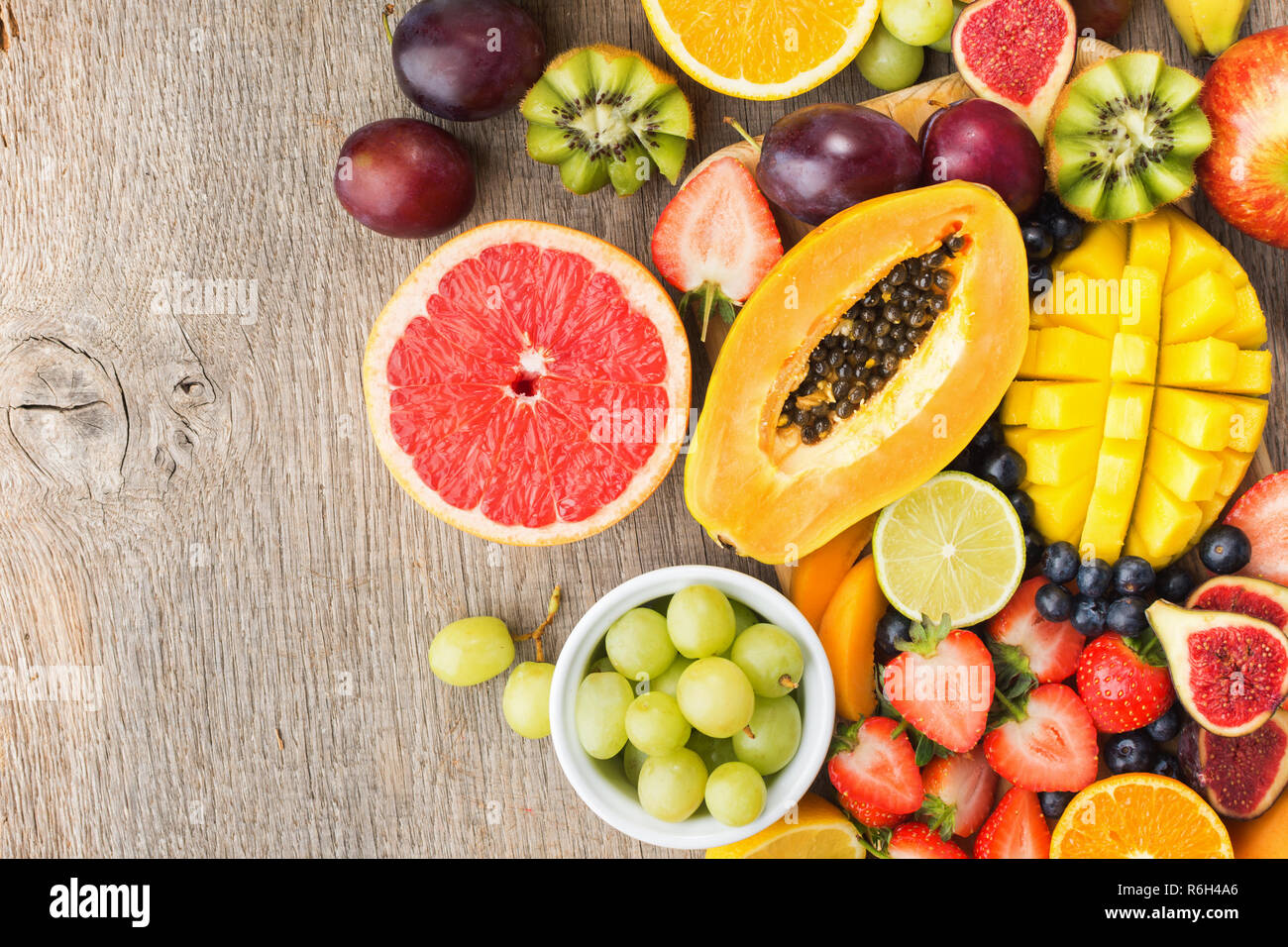 Variety of fruits, strawberries blueberries, mango orange, grapefruit ...