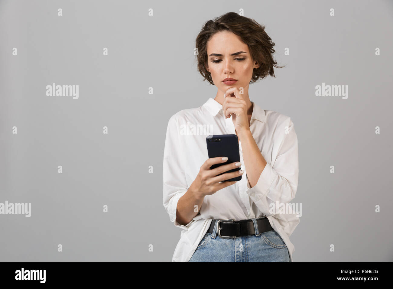 Image of thinking confused young business woman posing isolated over ...