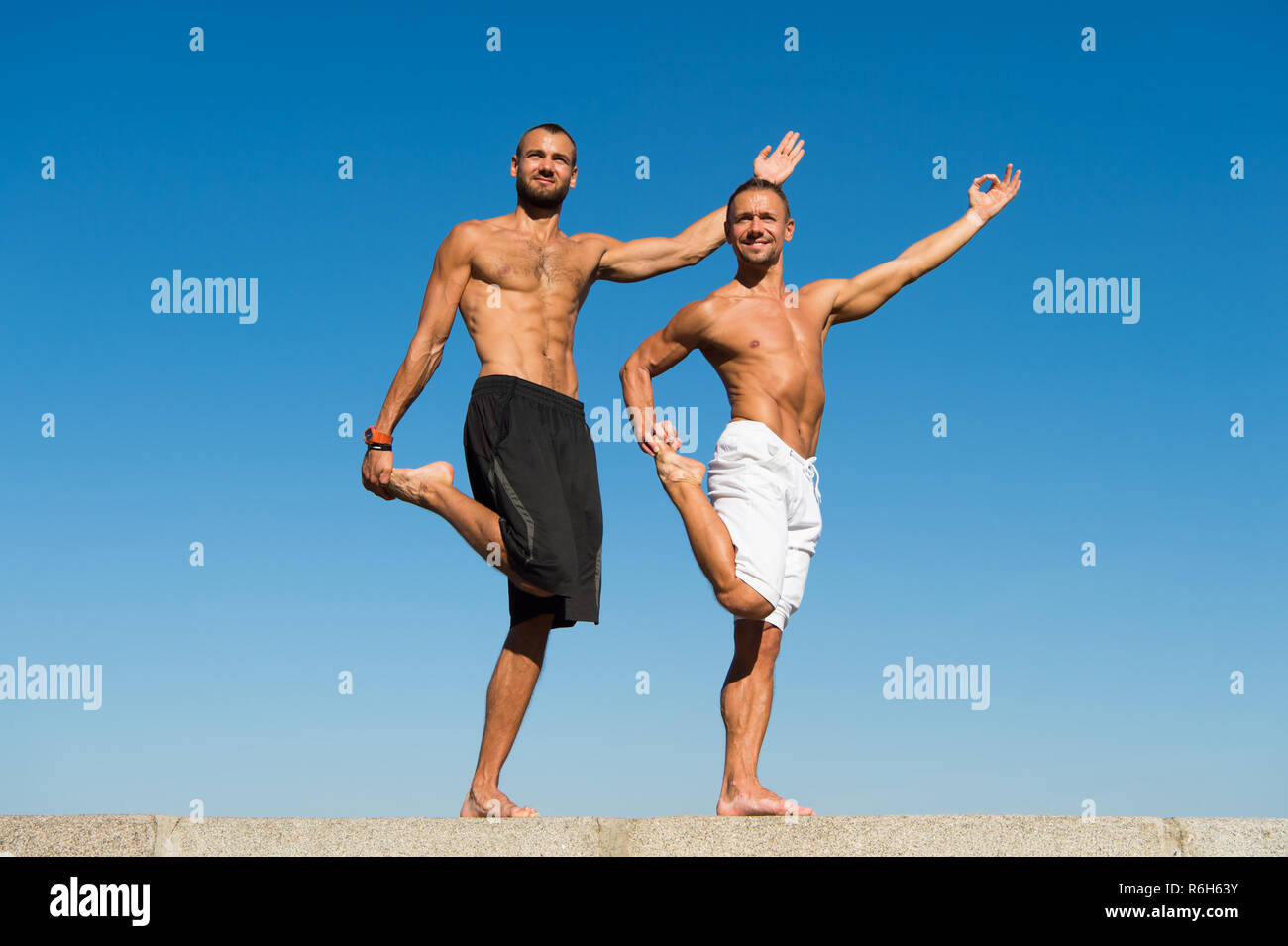 Success is steady progress. Muscular men do sport and fitness. Men with ...