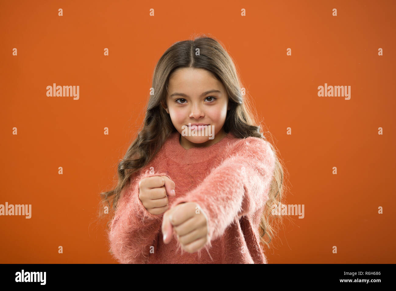 Girl hold fists ready attack or defend. Girl child cute but strong ...