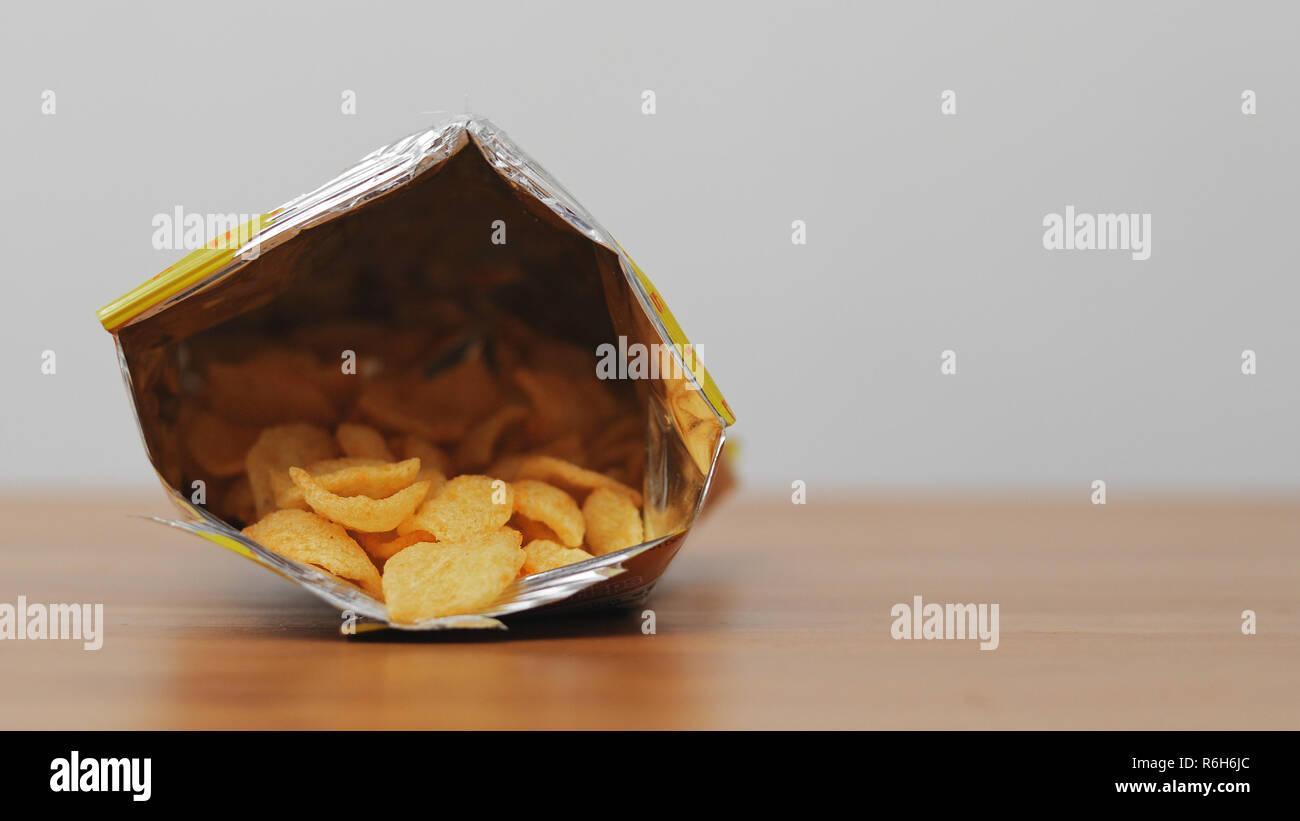 Taking Cheese crisp from pack Stock Photo - Alamy