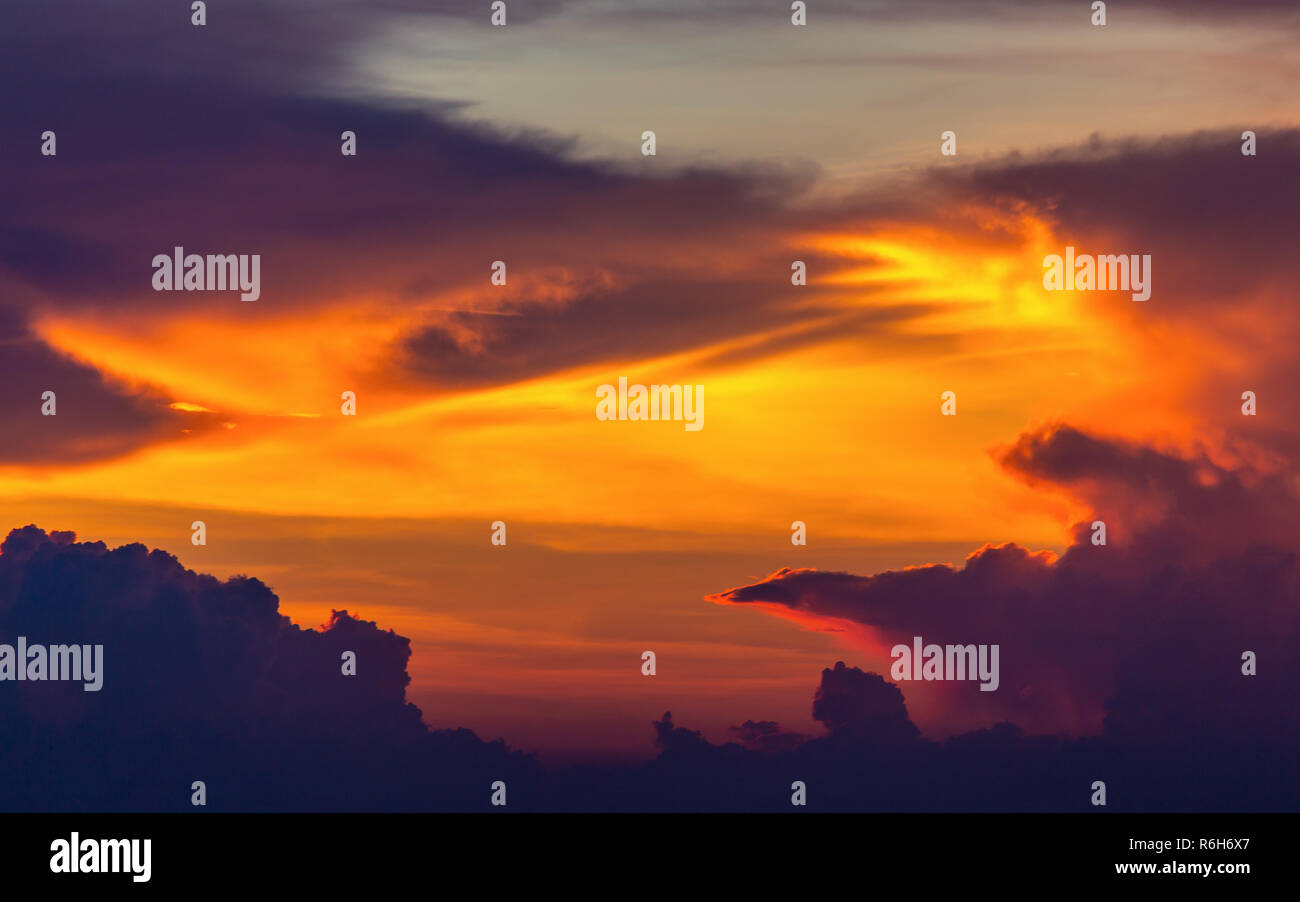 Aerial view of dramatic sky of sunset with saturated color of sunlight ...