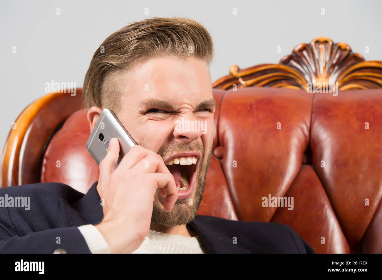 Angry boss. Man well groomed shout aggressively mobile phone grey ...