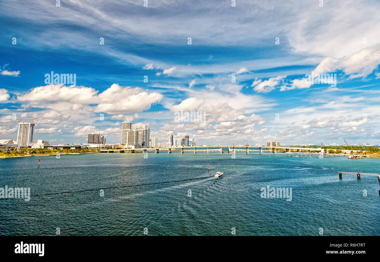 Miami landscape view on water channel, bridge with transportation on ...