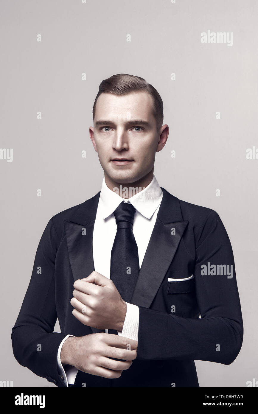 handsome young businessman or gentleman guy with fashionable hair in ...