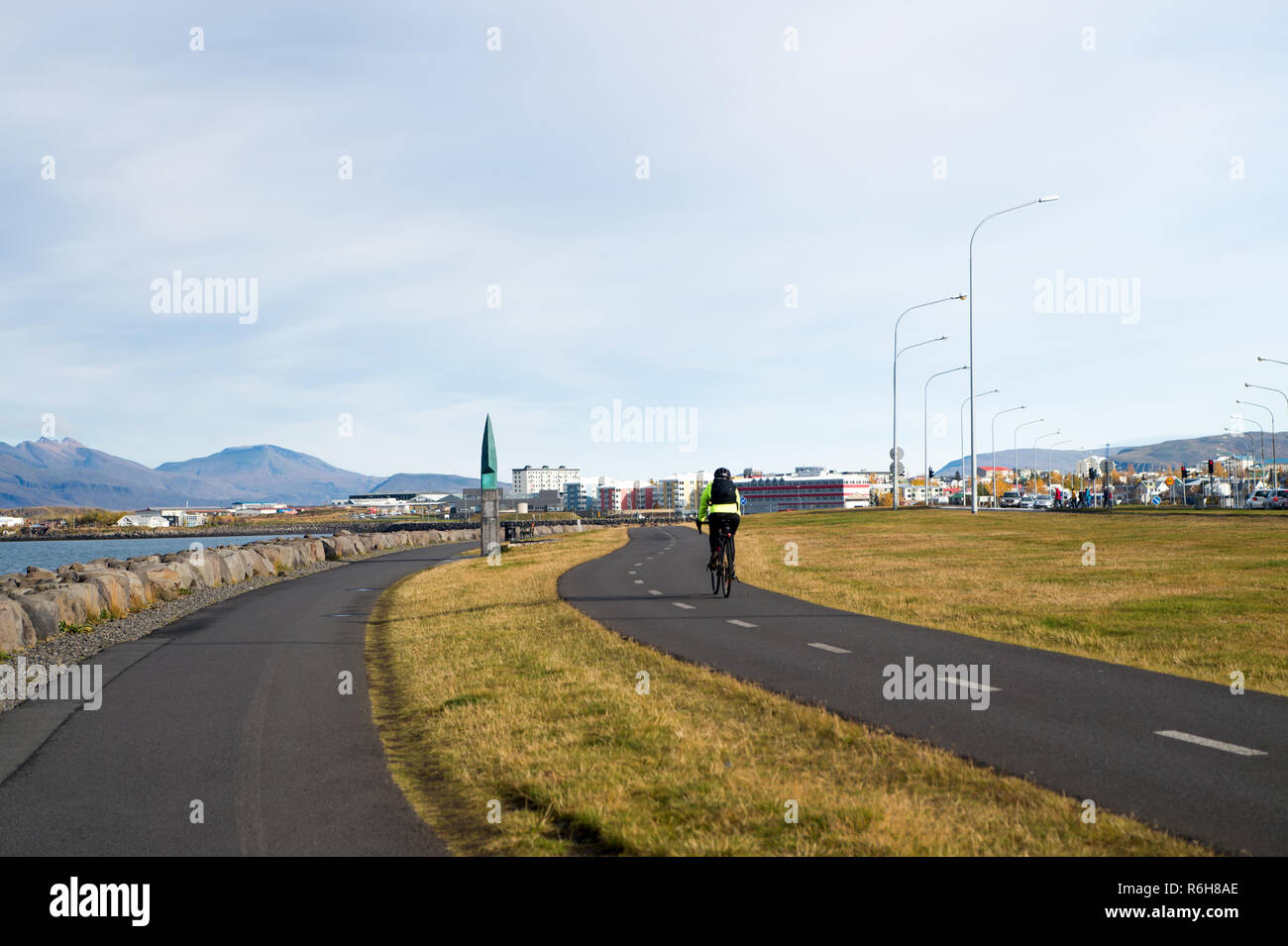 Road or path way green grass with cyclist on bike. Cycling culture and ...