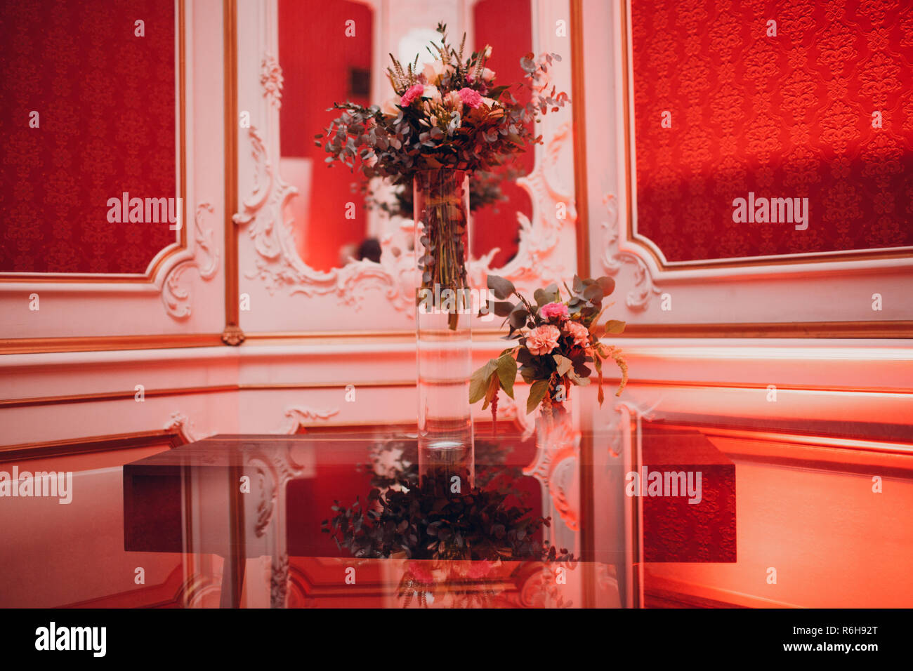 Hotel lobby in red color, decorated with a large vase of flowers Stock ...