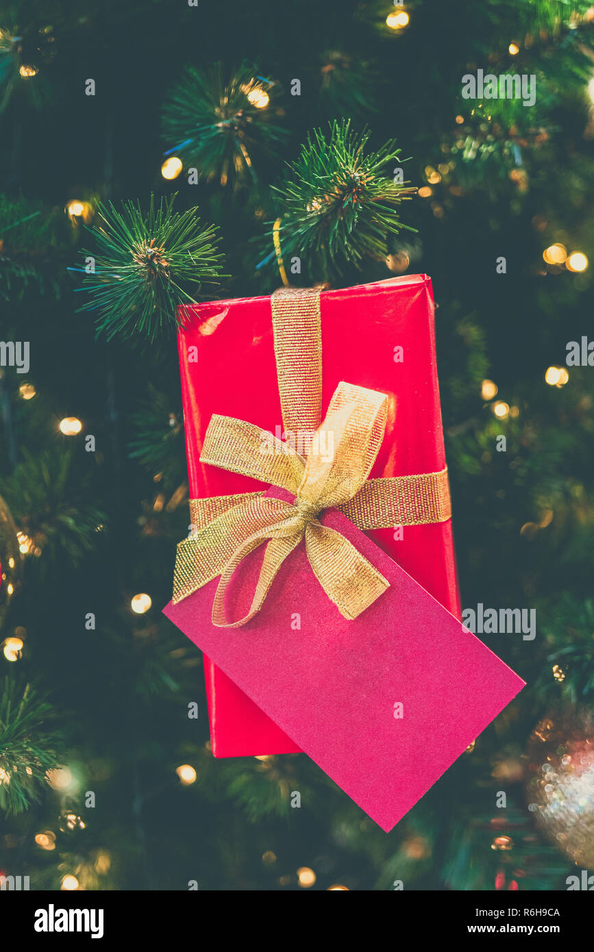 Red gift box hanging hi-res stock photography and images - Alamy