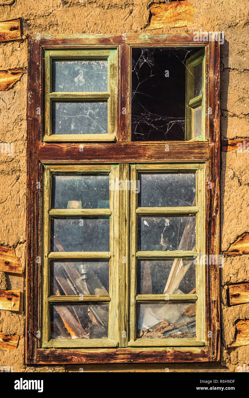 A pile of chopped wood, rusty window Stock Photo - Alamy