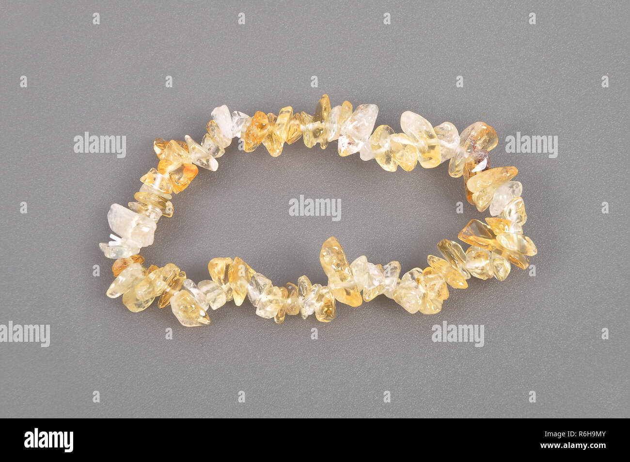 citrine splinter chain on gray background Stock Photo - Alamy
