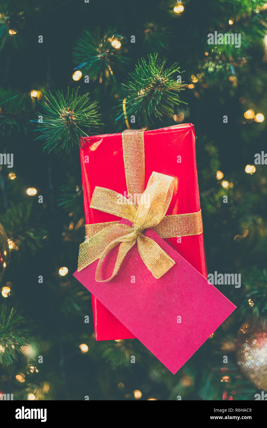 Red gift box hanging hi-res stock photography and images - Alamy