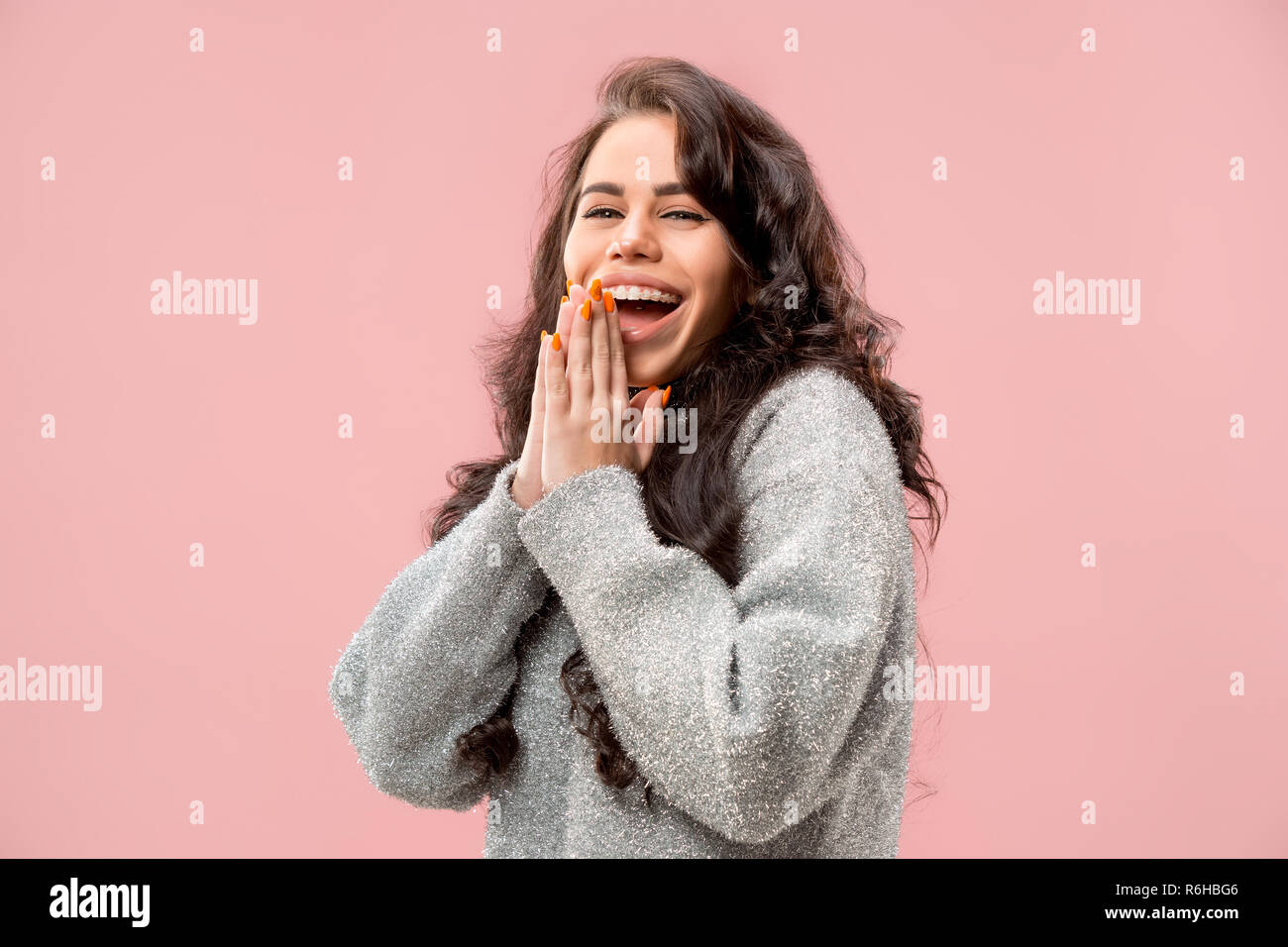 Delight. Beautiful female half-length front portrait isolated on pink ...