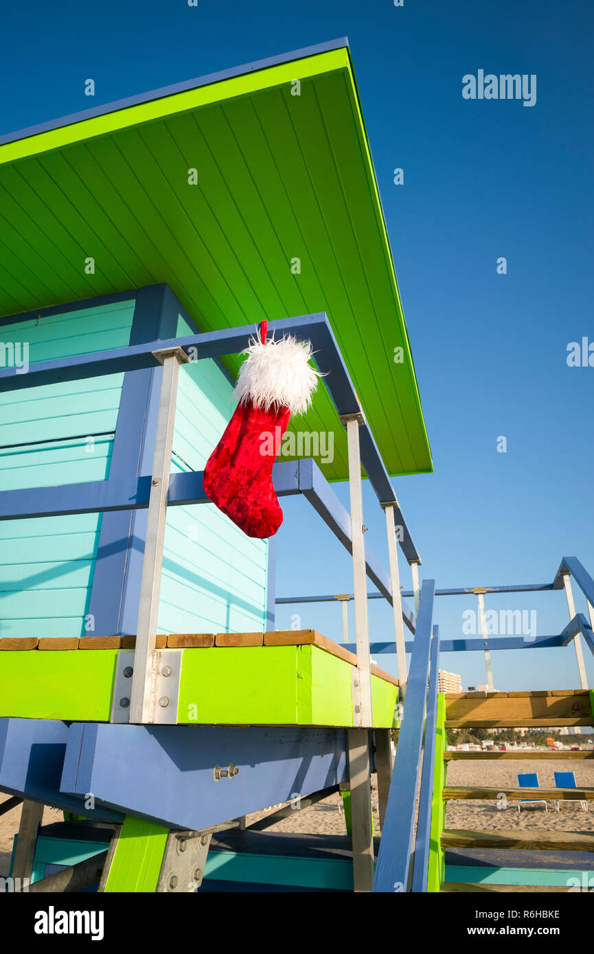 Bright tropical Christmas scene of Santa stocking hanging from a ...