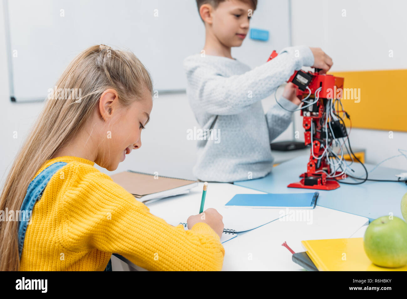 children working on task at STEM robotics lesson Stock Photo - Alamy