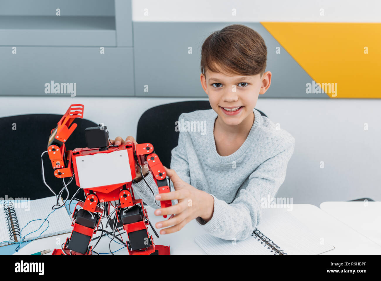 schoolboy working with robot at STEM robotics lesson Stock Photo - Alamy