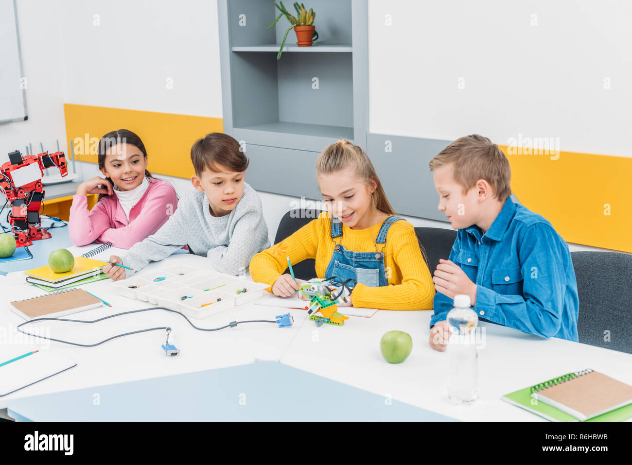 happy children working together on STEM project in classrom Stock Photo ...