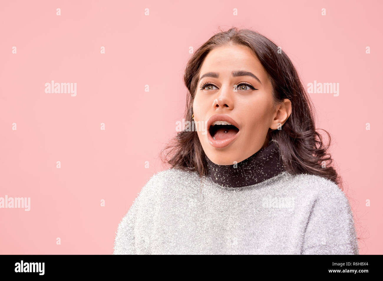 Delight. Beautiful female half-length front portrait isolated on pink ...