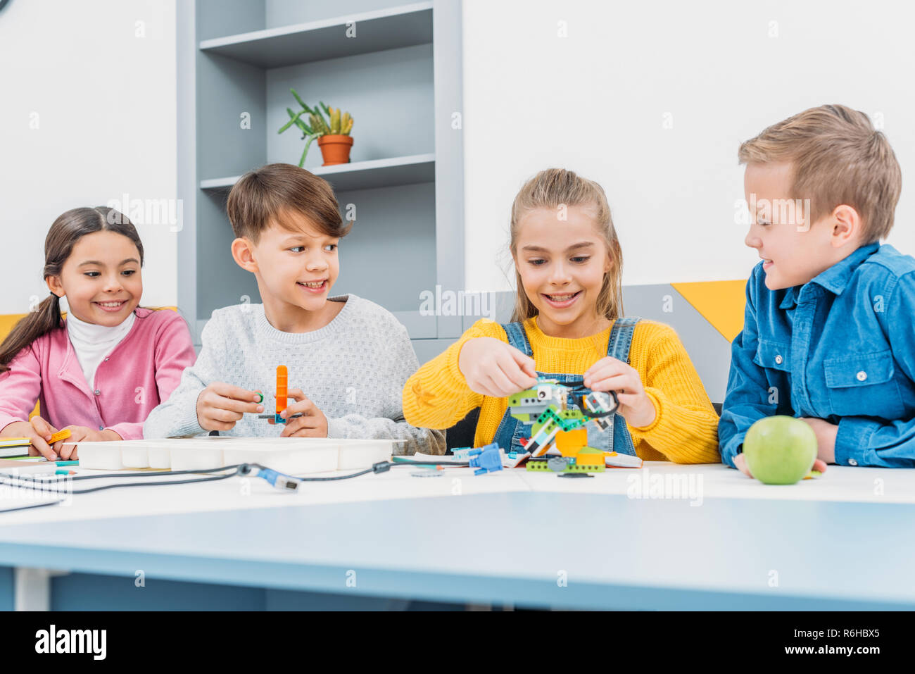 schoolchildren working on robot programming at STEM class Stock Photo ...
