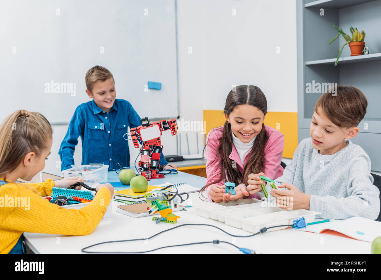 schoolkids working on robot at STEM robotics lesson Stock Photo - Alamy