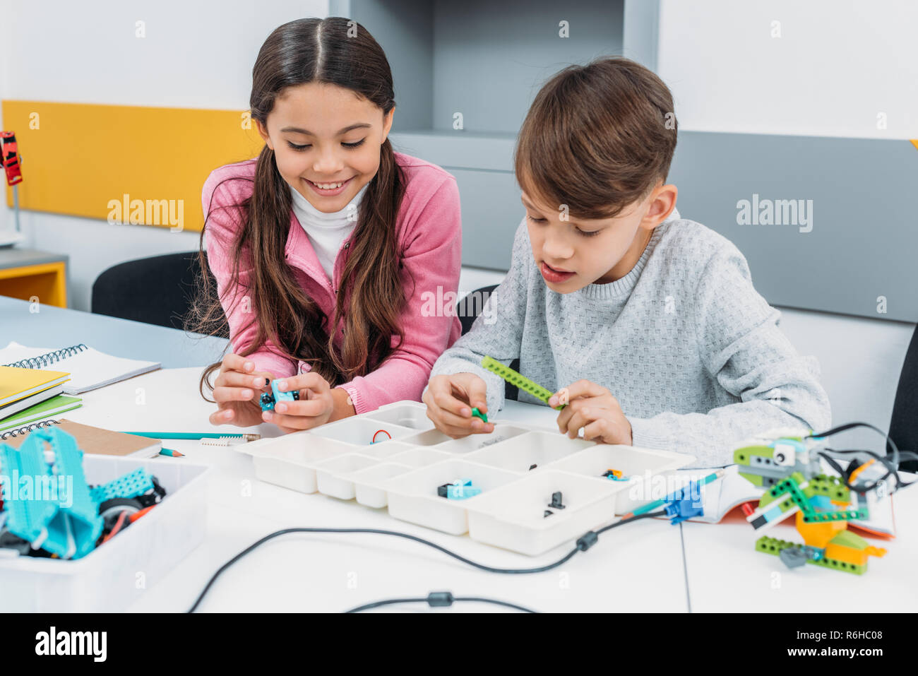 schoolchildren working on robot at STEM robotics lesson Stock Photo - Alamy