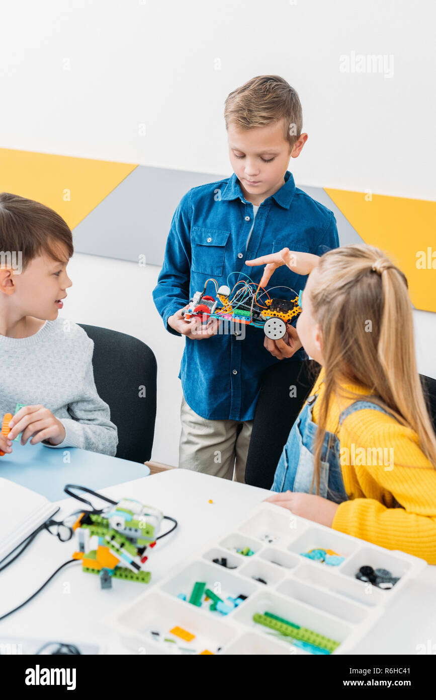 children making electric robot in stem education class Stock Photo - Alamy