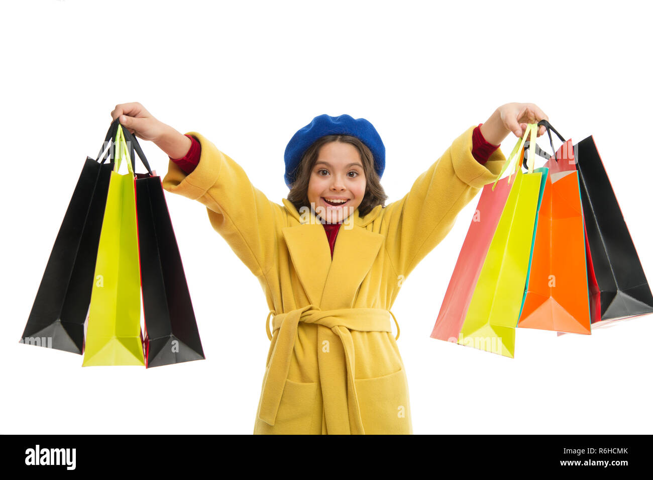 Little girl happy face hold bunch shopping bags. Shopaholic concept ...
