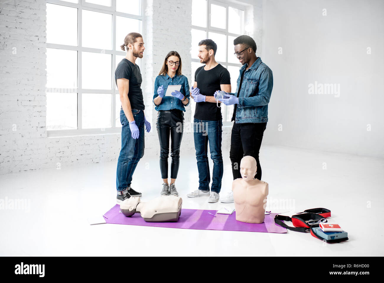 Young people standing and talking together during the first aid ...