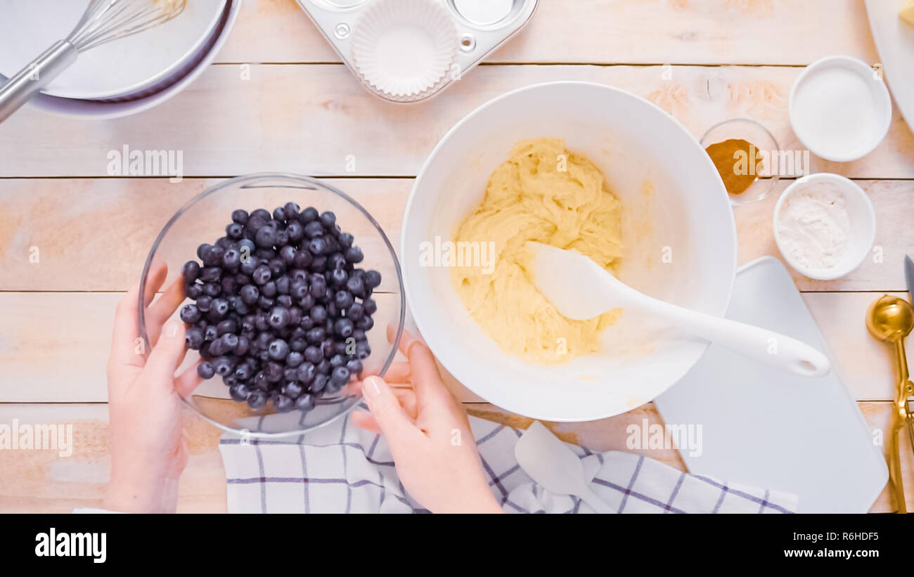 Mixing ingredients together in mixing bowl for blueberry muffins Stock ...