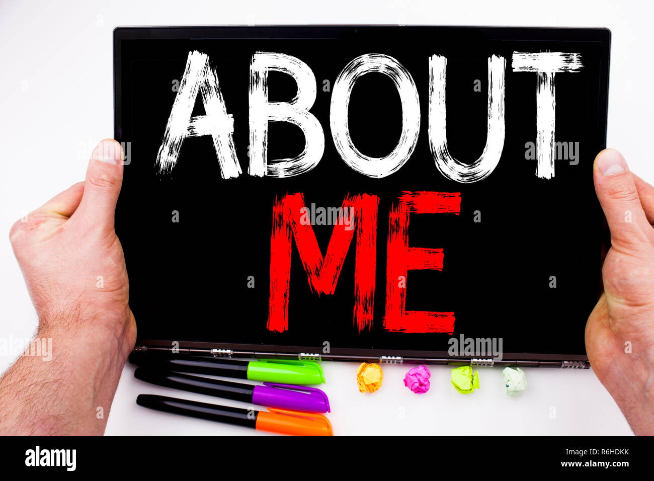 About Me text written on tablet, computer in the office with marker ...